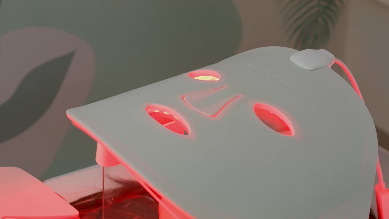 Woman with red LED mask in a spa - Free Stock Video