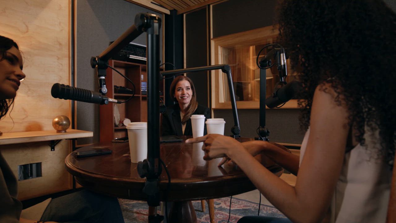 Women drinking coffee at a podcast - Free Stock Video