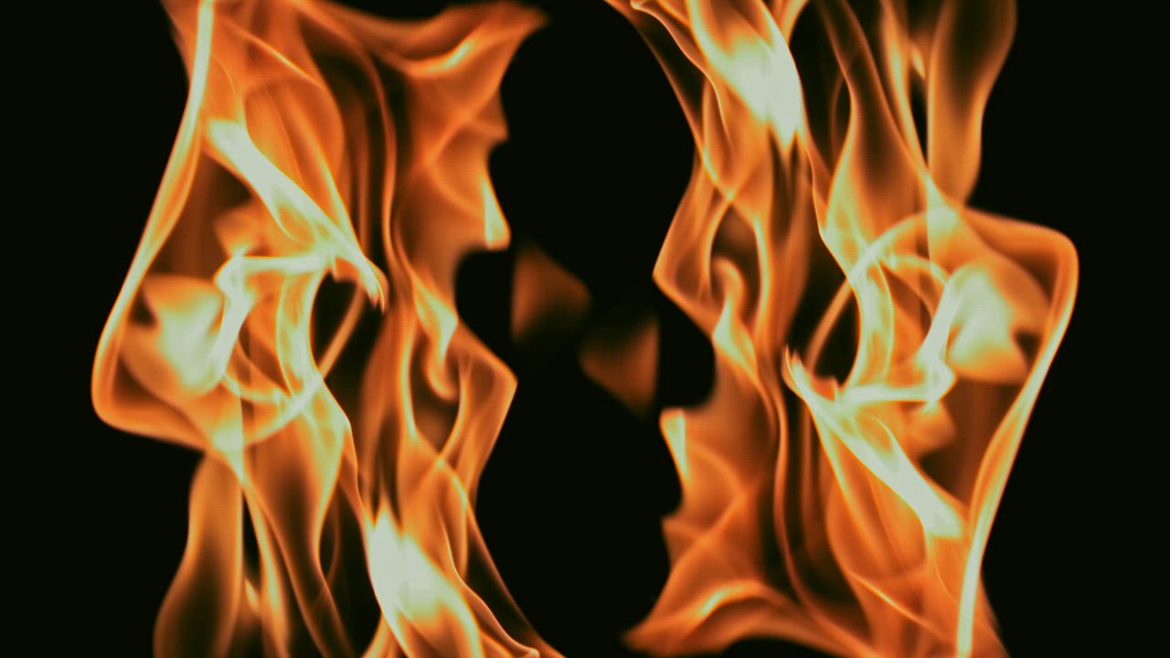 Flames on the screen flow from top to bottom and vice versa over a ...