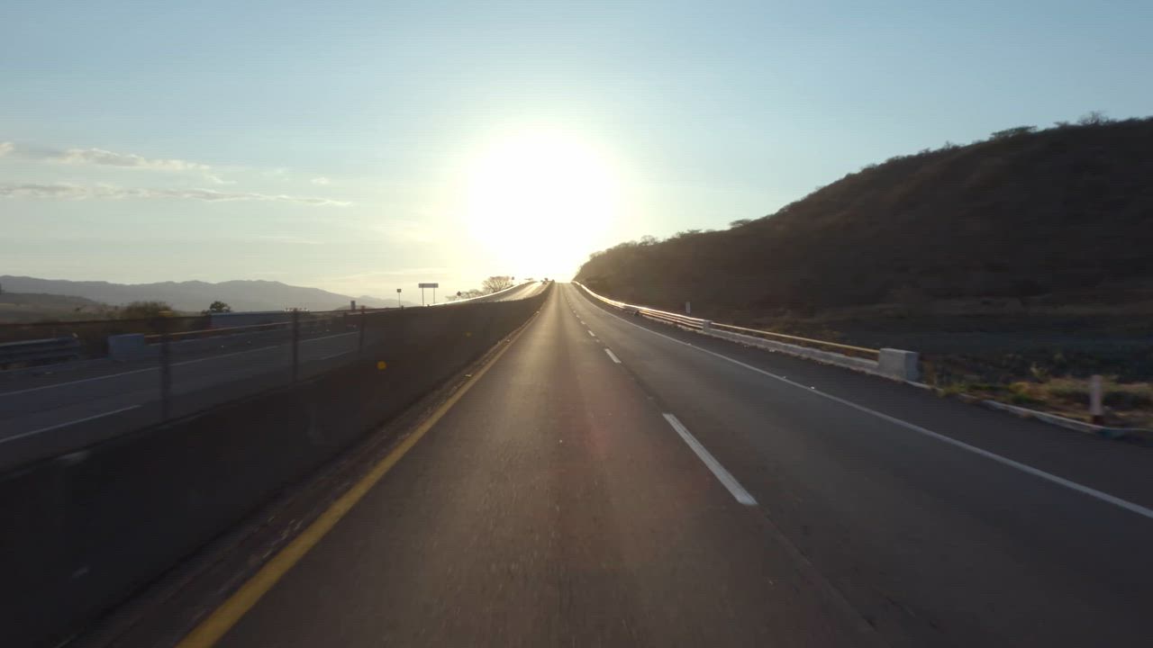 Traveling along from the driver point of view over an asphalt a black ...