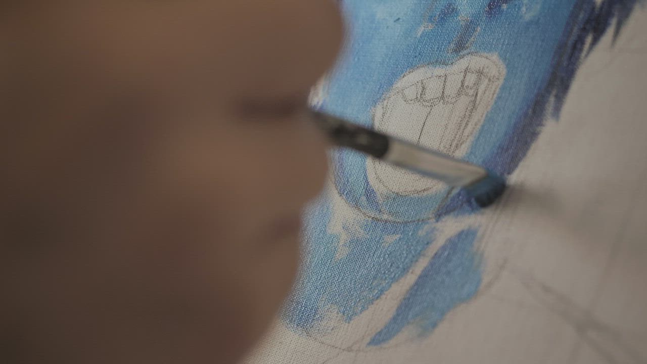 Abstract face of blue color being painted - Free Stock Video