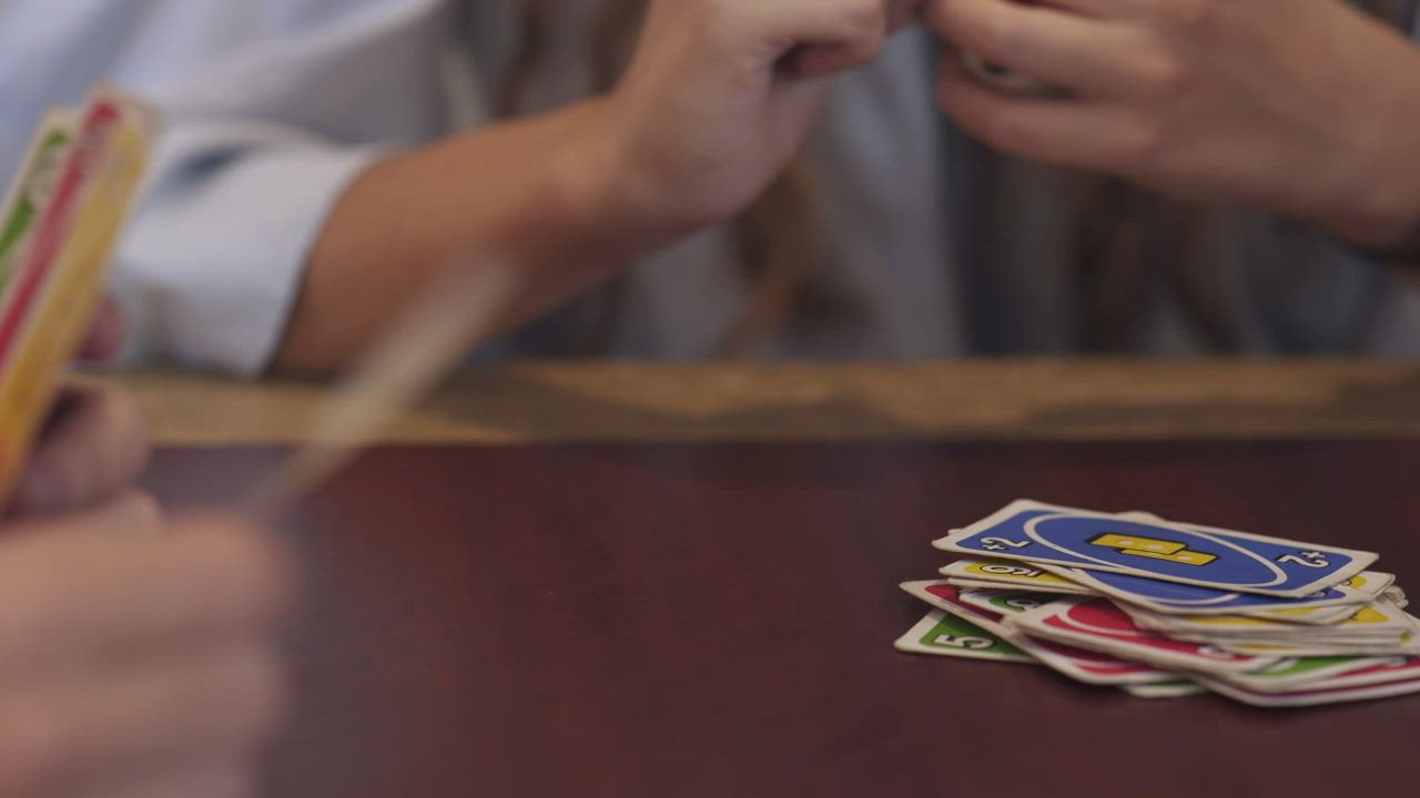 Playing a game of UNO with friends - Free Stock Video