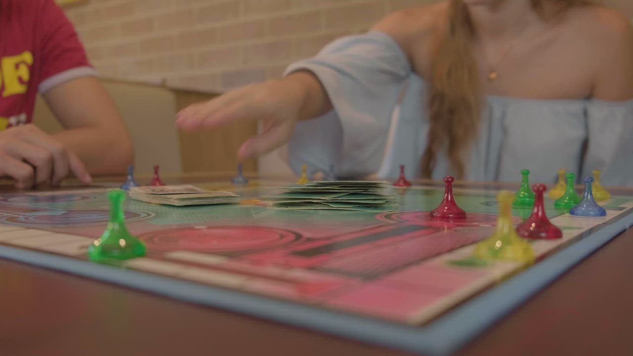 Board game with people around playing - Free Stock Video