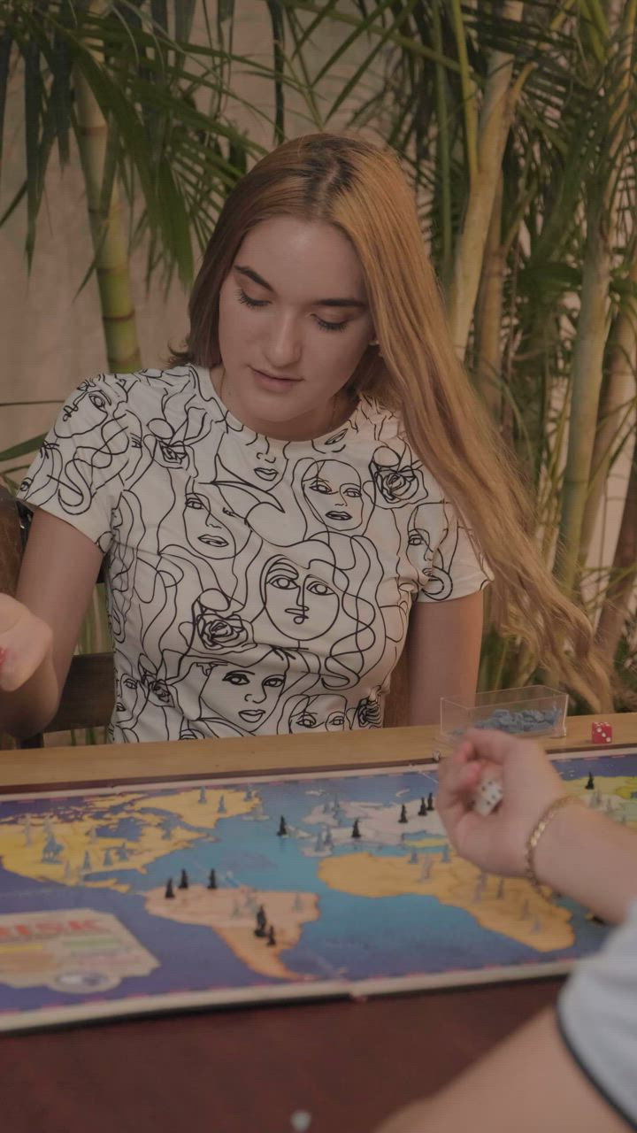 Young woman playing Risk - Free Stock Video