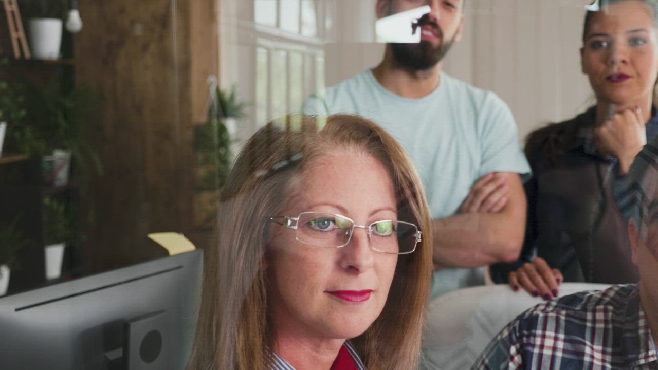 Team collaborates on idea with notes on window - Free Stock Video