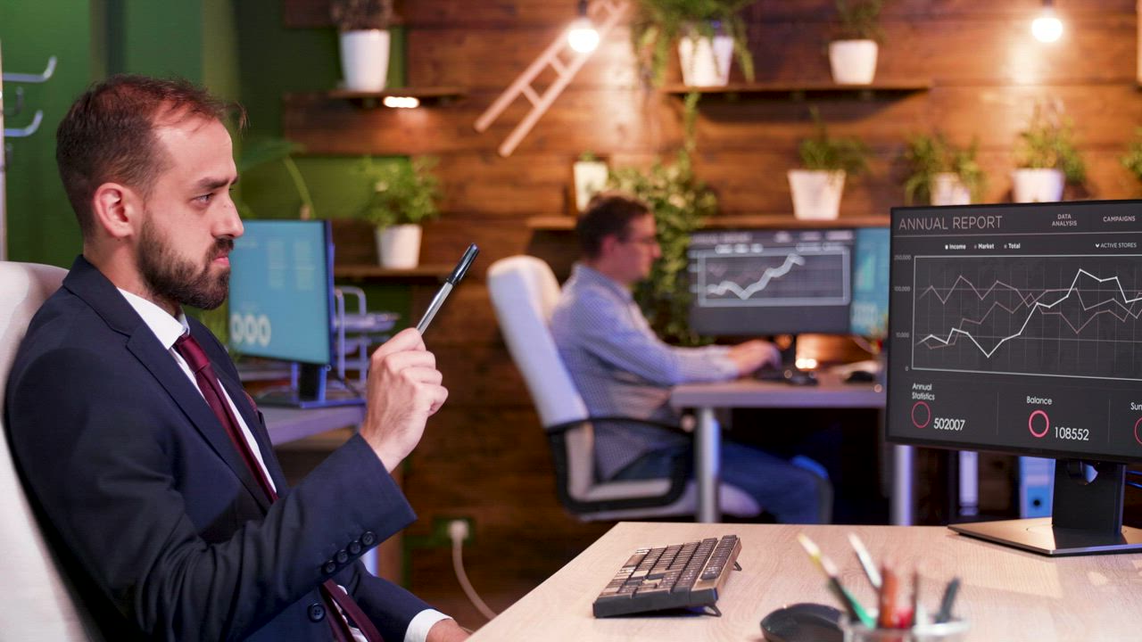 Man looking at monitors - Free Stock Video