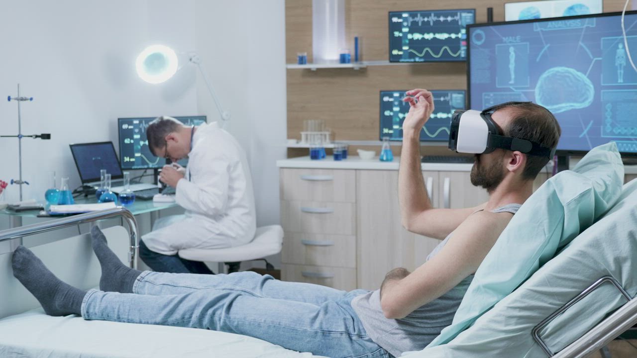 Patient looks at brain using VR technology in modern hospital - Free ...