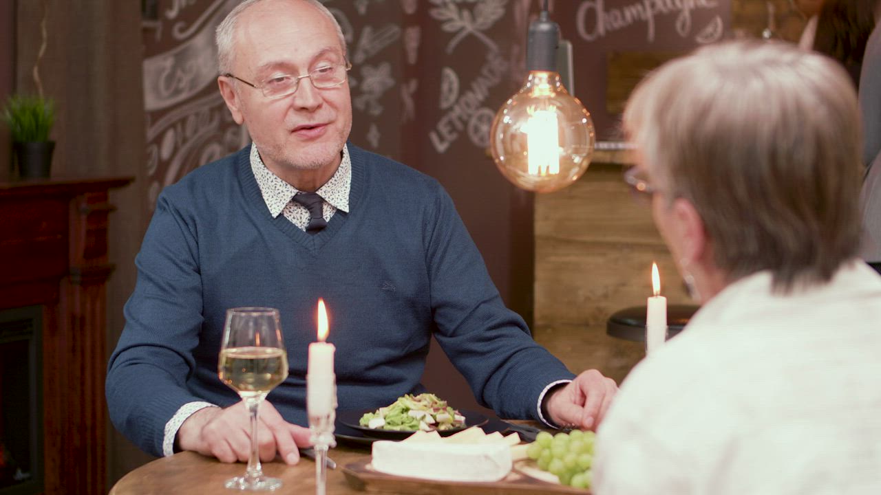 Older man chats about wedding and proposes on date - Free Stock Video