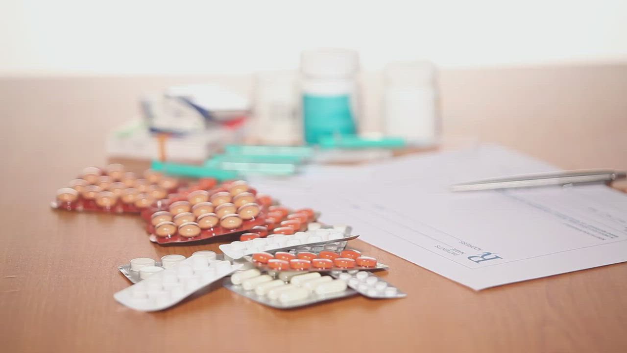 Doctor writing prescription for pharmacy drugs - Free Stock Video
