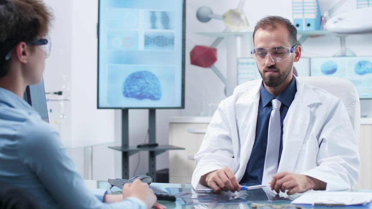 Doctor demonstrates medical innovation with AR Tech - Free Stock Video