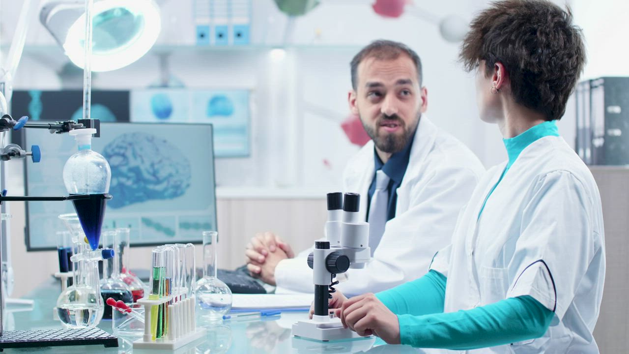 Two men working in a laboratory - Free Stock Video