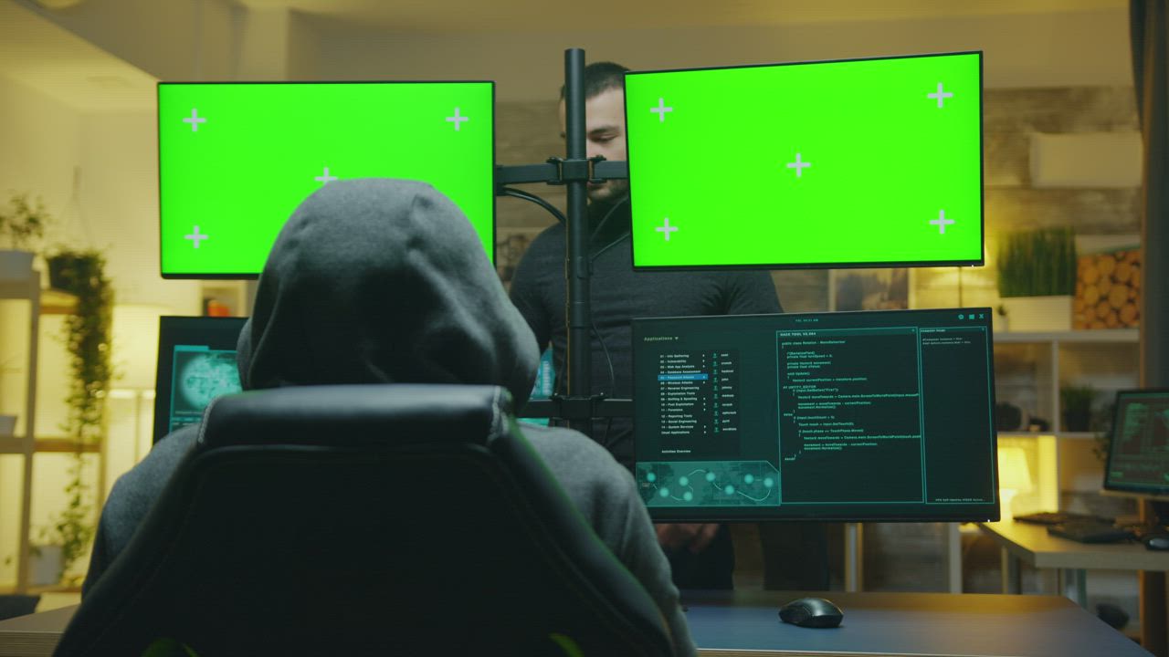 Hackers with multiple screens - Free Stock Video