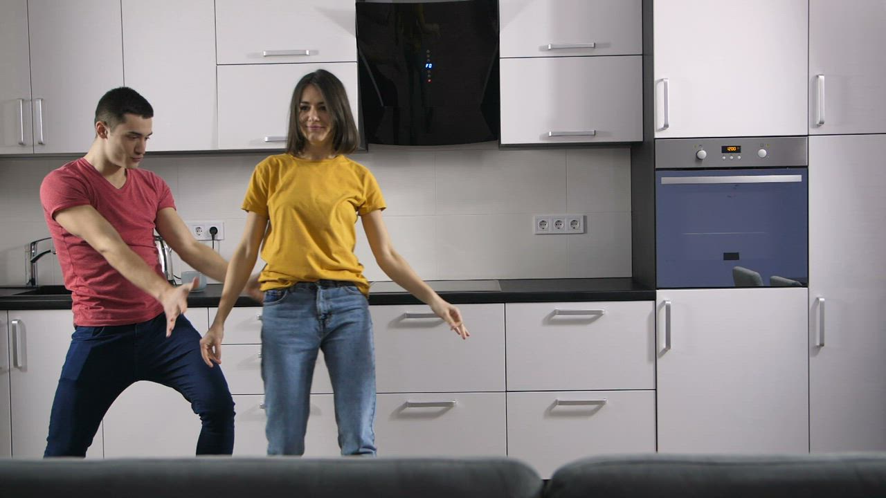 Couple dancing in the kitchen - Free Stock Video