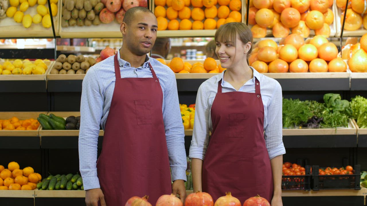 Grocery store staff hugging - Free Stock Video