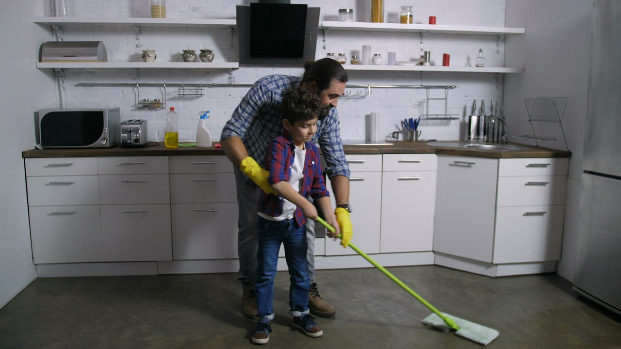 Father and son cleaning their house - Free Stock Video
