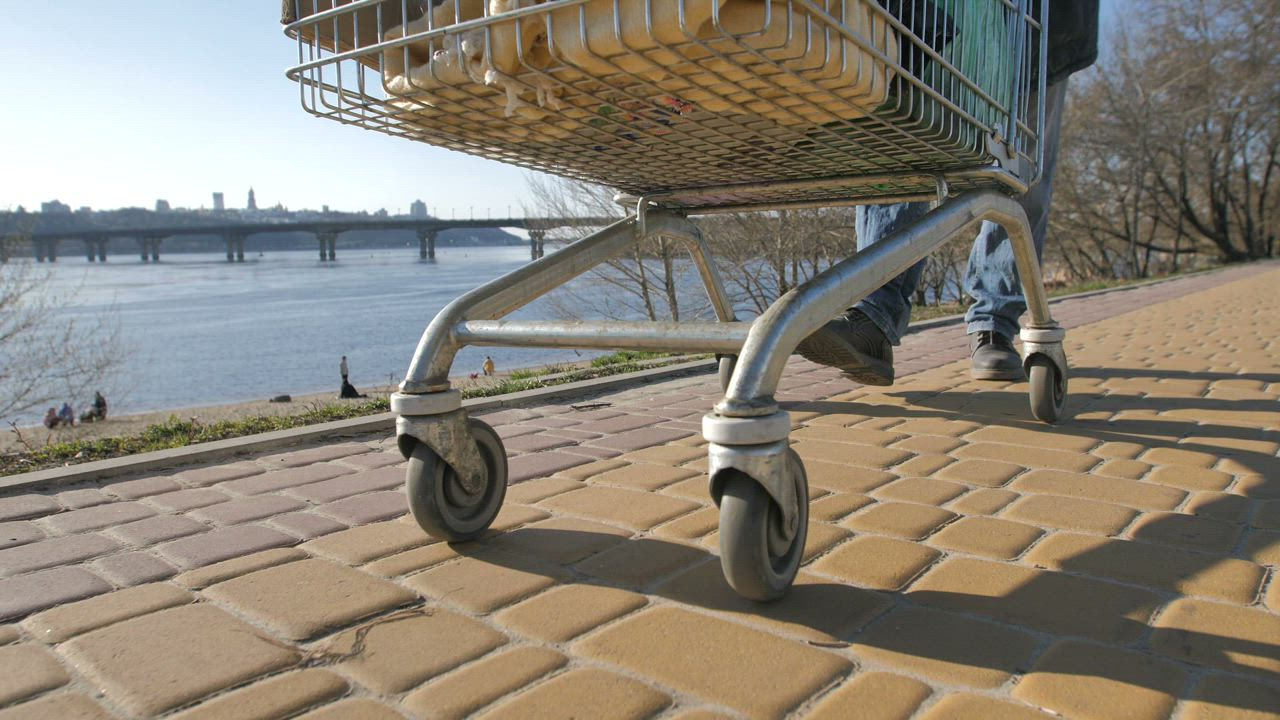 Homeless man with a cart - Free Stock Video