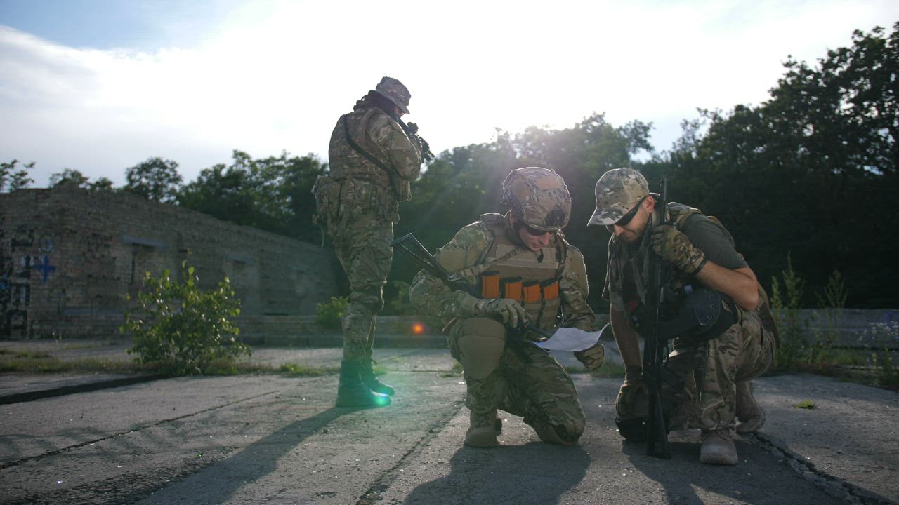 Soldiers using a map - Free Stock Video