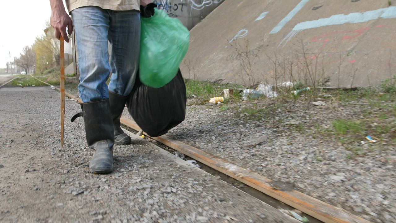 Homeless man collecting bottles - Free Stock Video