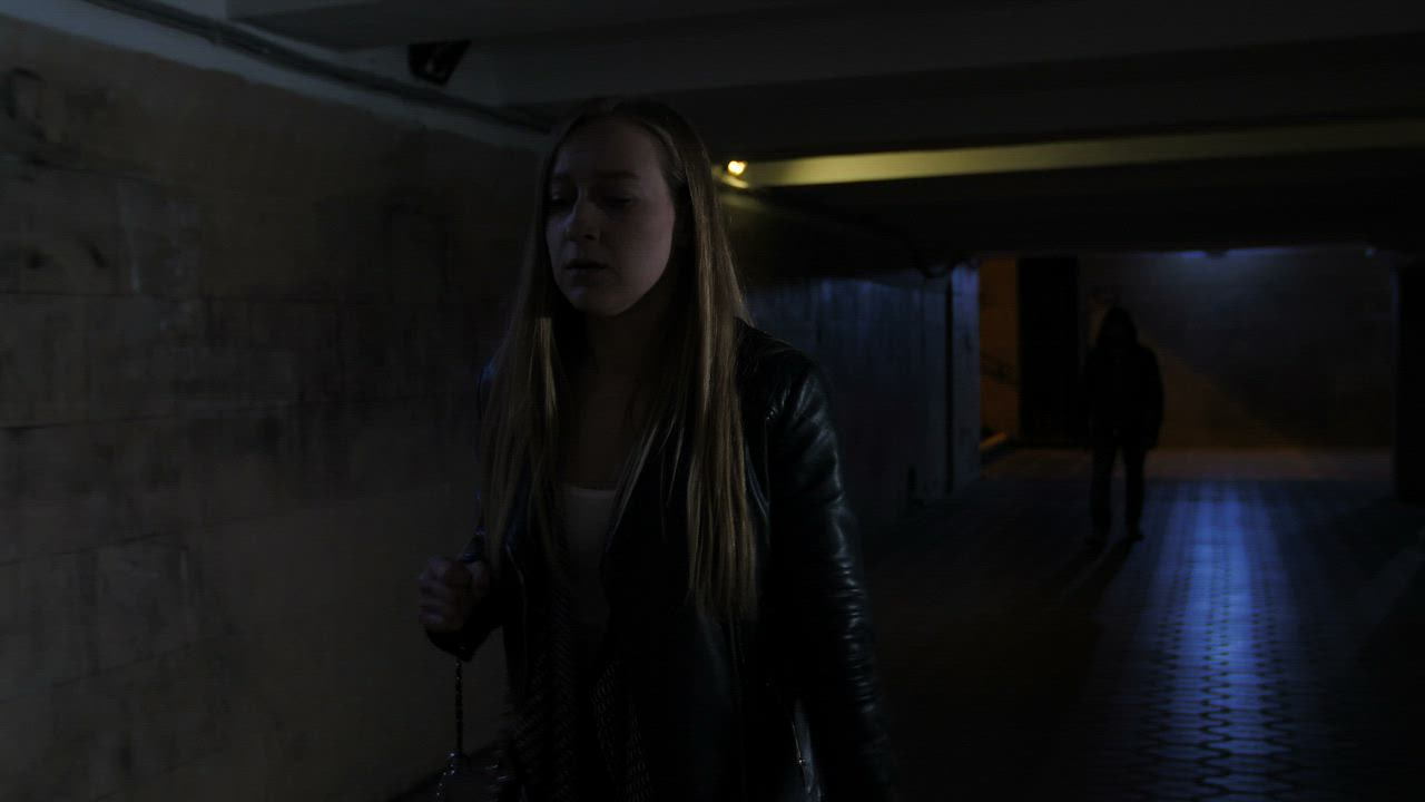 Scared woman walking at night - Free Stock Video