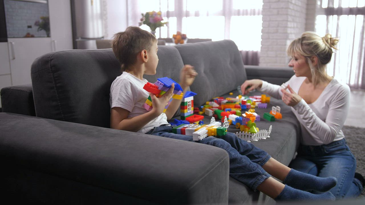 Mother building blocks with her son - Free Stock Video