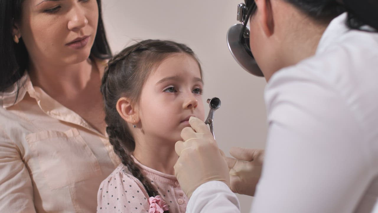 Child crying during a visit to the Doctor - Free Stock Video
