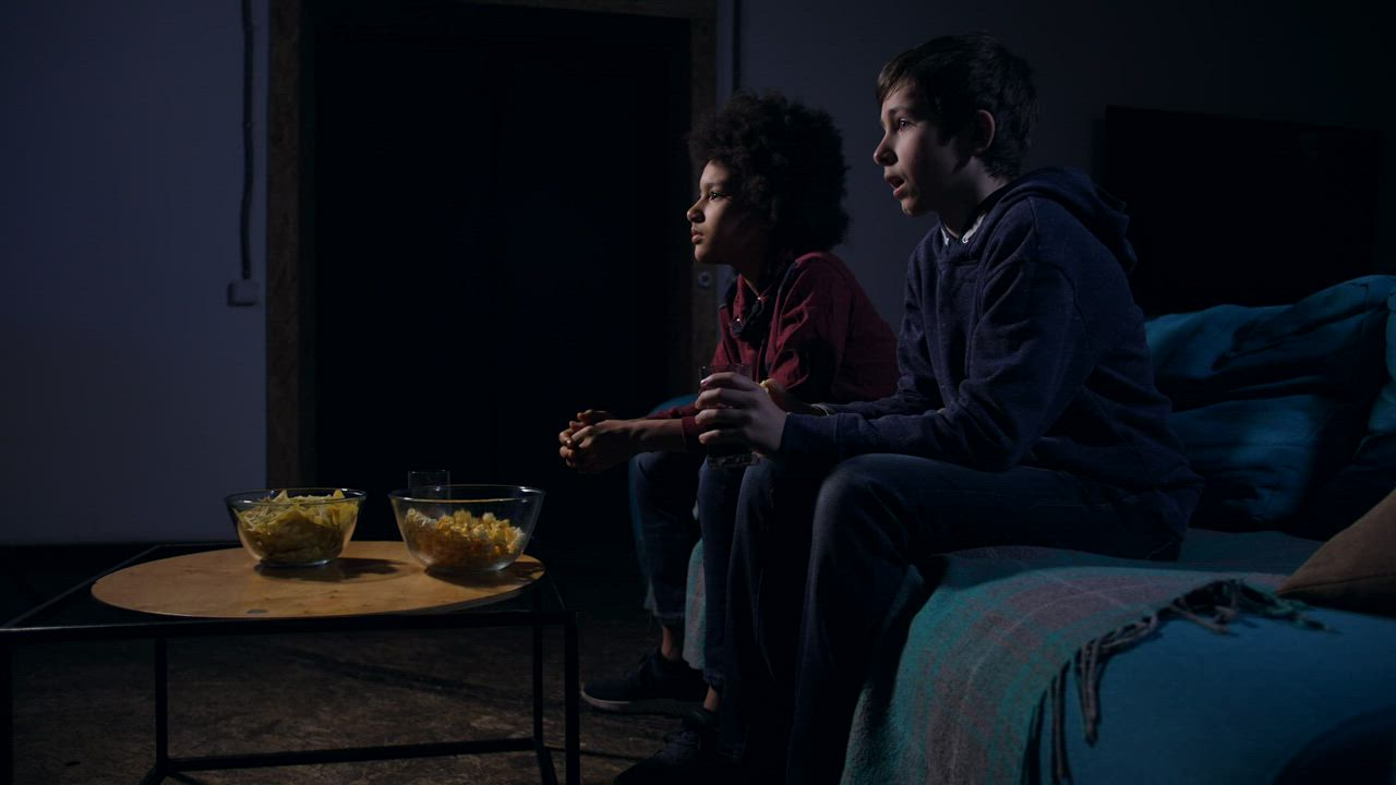 Scared boys watching a horror film - Free Stock Video