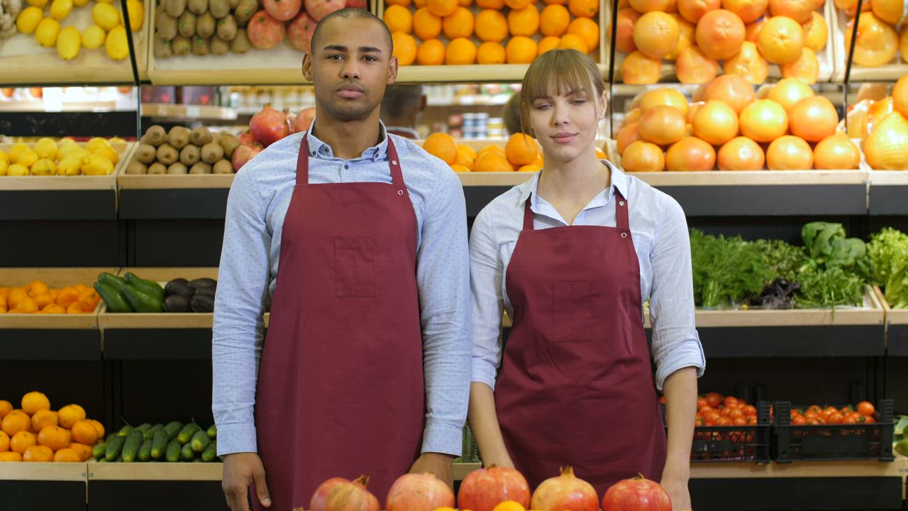 Grocery store staff folding their arms - Free Stock Video