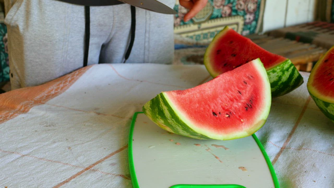 Watermelon being cut by knife - Free Stock Video
