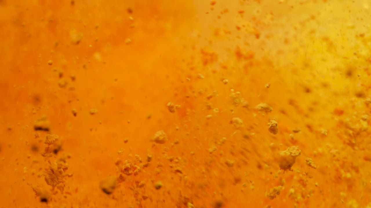 Orange and yellow powder - Free Stock Video