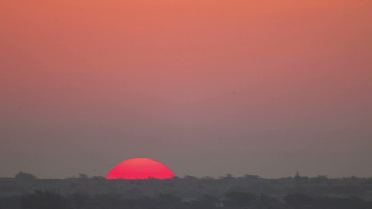 Red sun rising in the warm morning - Free Stock Video