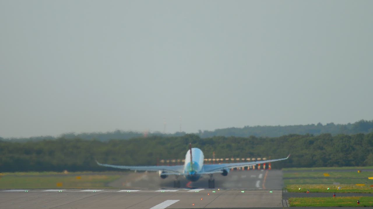 Airplane taking off the airport track - Free Stock Video