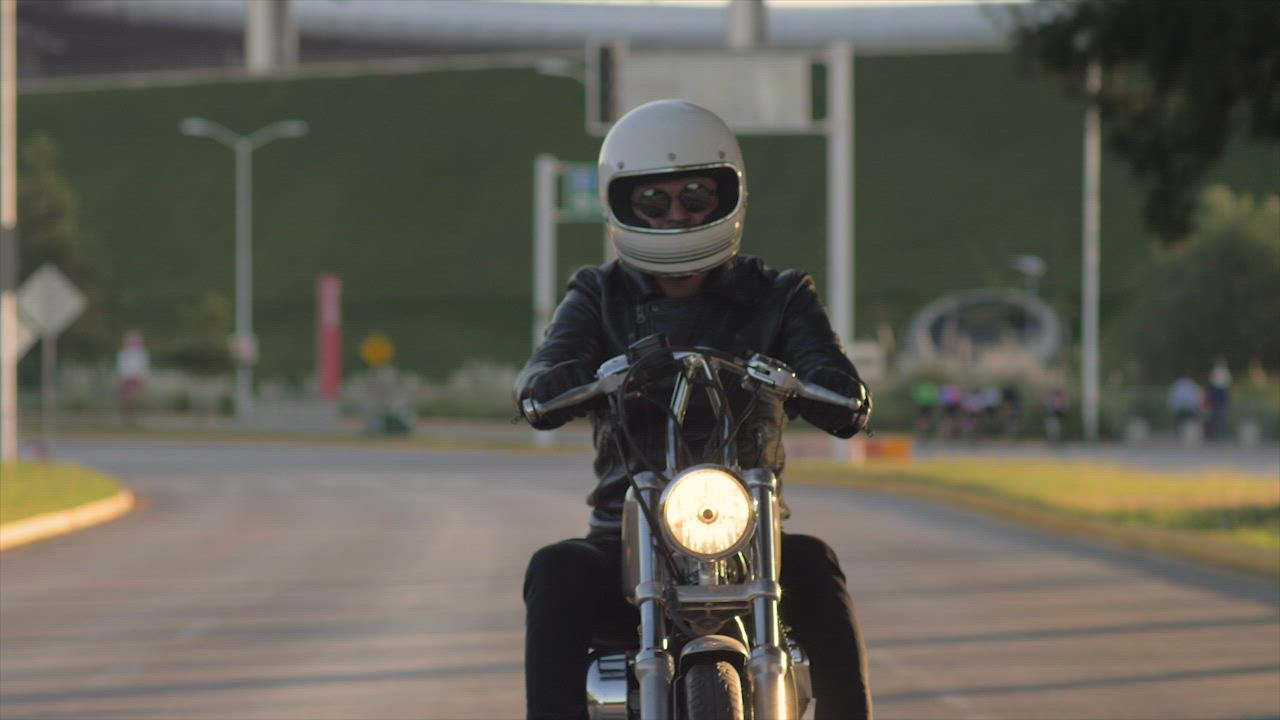 Person driving a motorcycle on a lonely street - Free Stock Video