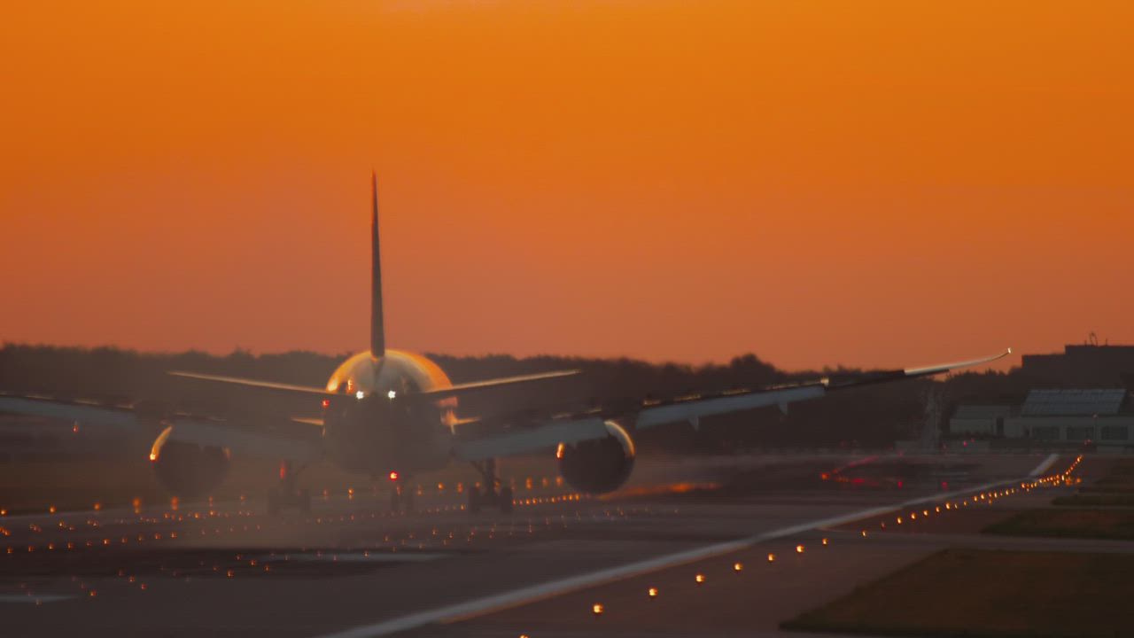 Airplane moving trough the airport track in the morning - Free Stock Video