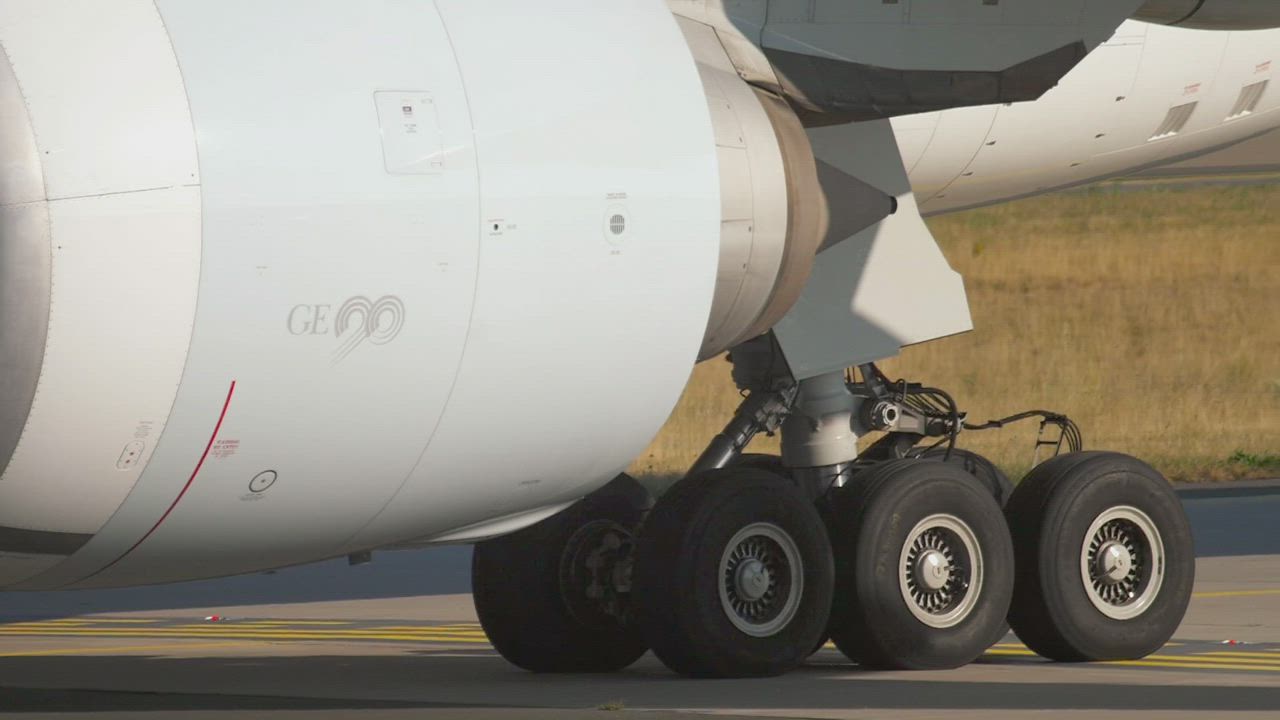 Engine and gear of airplane close up - Free Stock Video