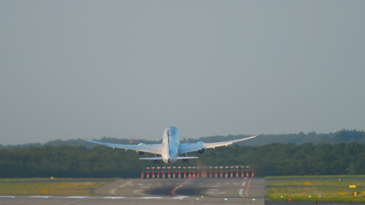 Full shot of an airplane taking off the track - Free Stock Video