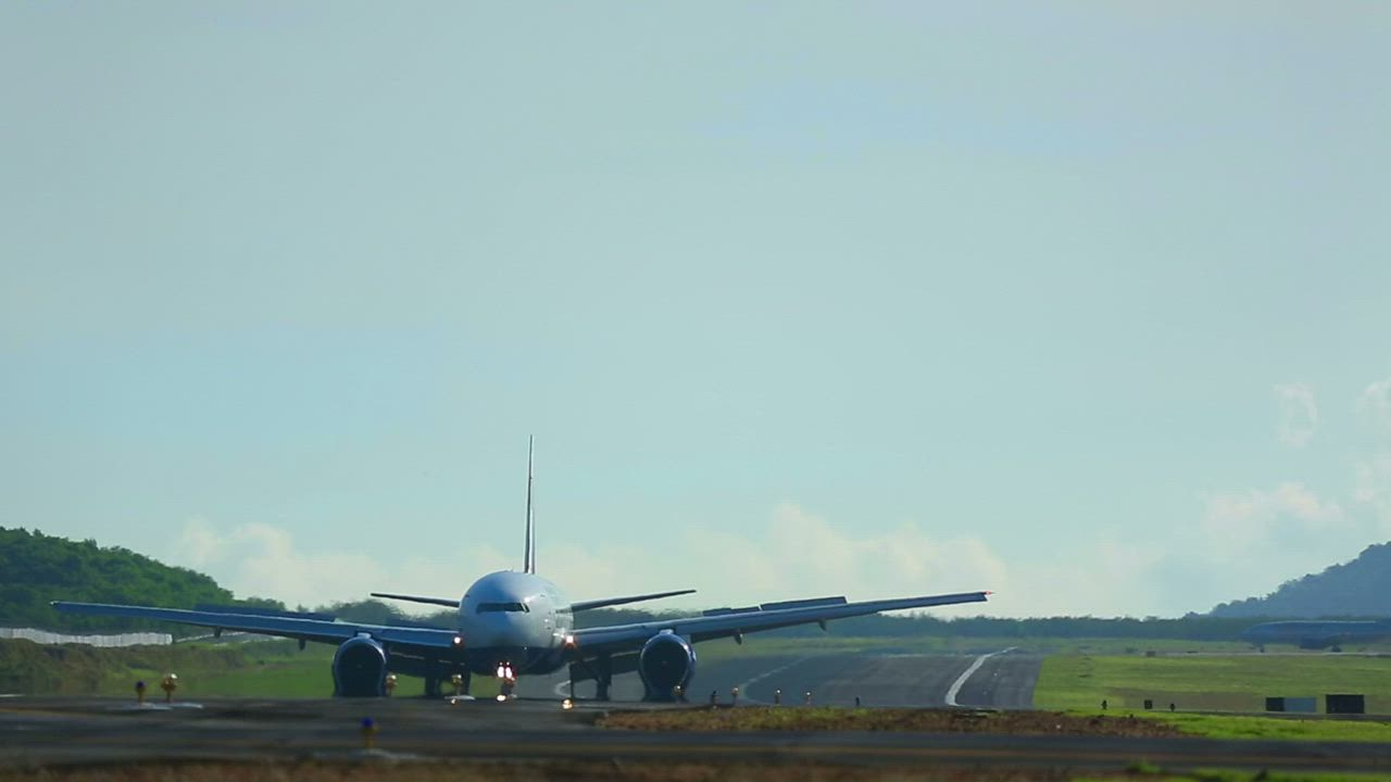 Airplane moving on a clear day - Free Stock Video