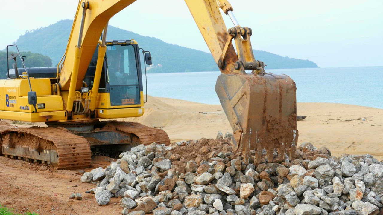 Excavator moving rocks - Free Stock Video