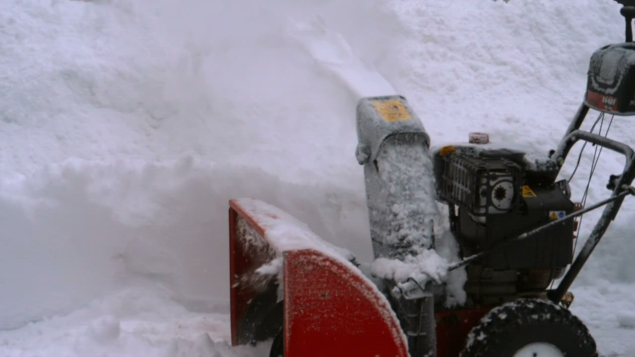 Snow blowing machine working - Free Stock Video