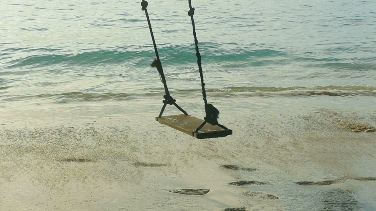 Rope swings on a sandy the beach - Free Stock Video