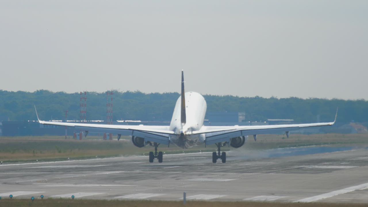 Plane landing in the airport during the day - Free Stock Video