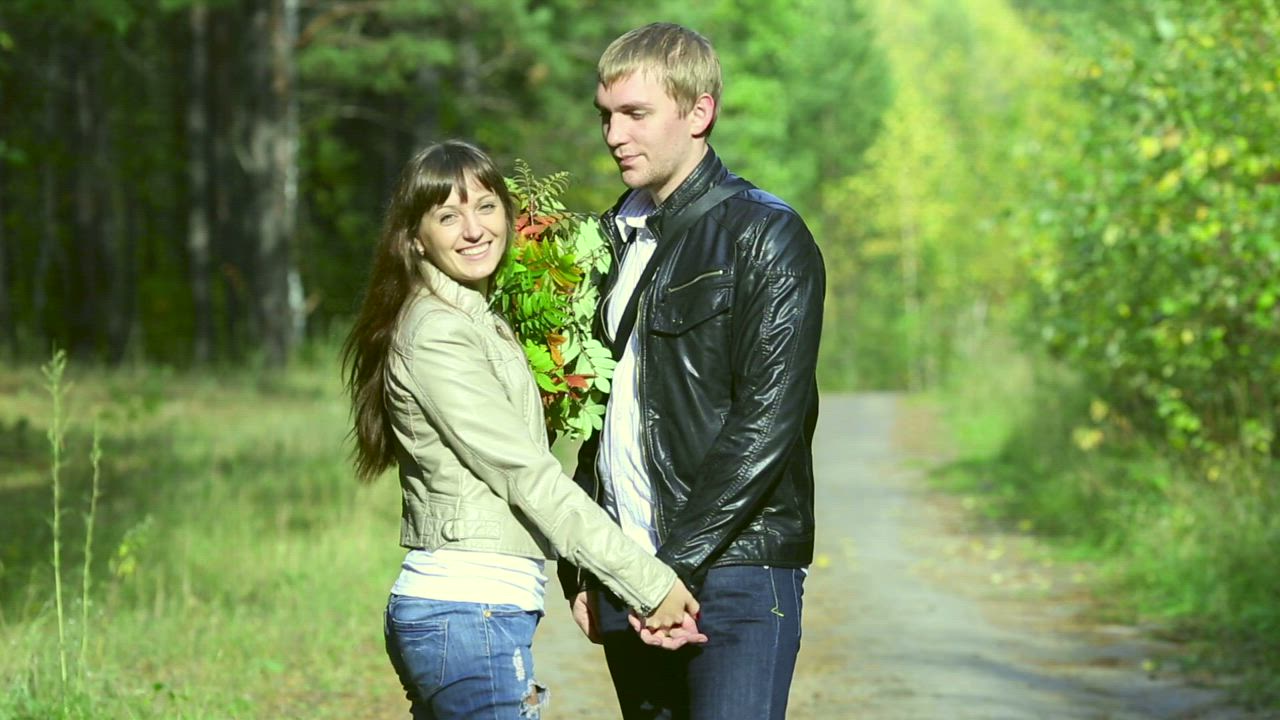 Couple holding hands and walking - Free Stock Video