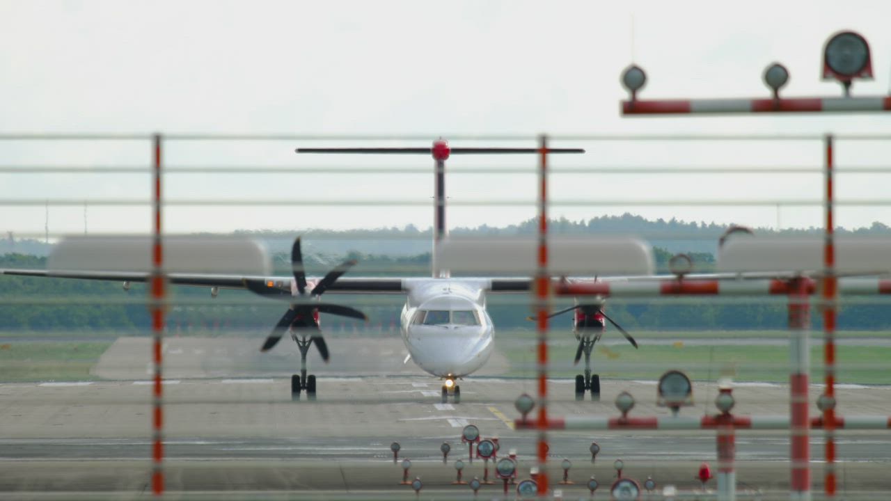 An airplane stopping at the airport - Free Stock Video