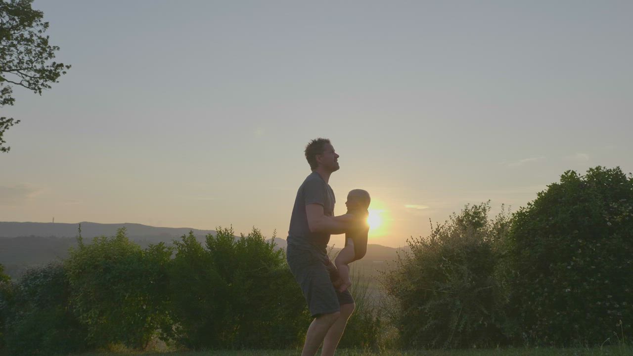 Adorable baby outside at sunset - Free Stock Video