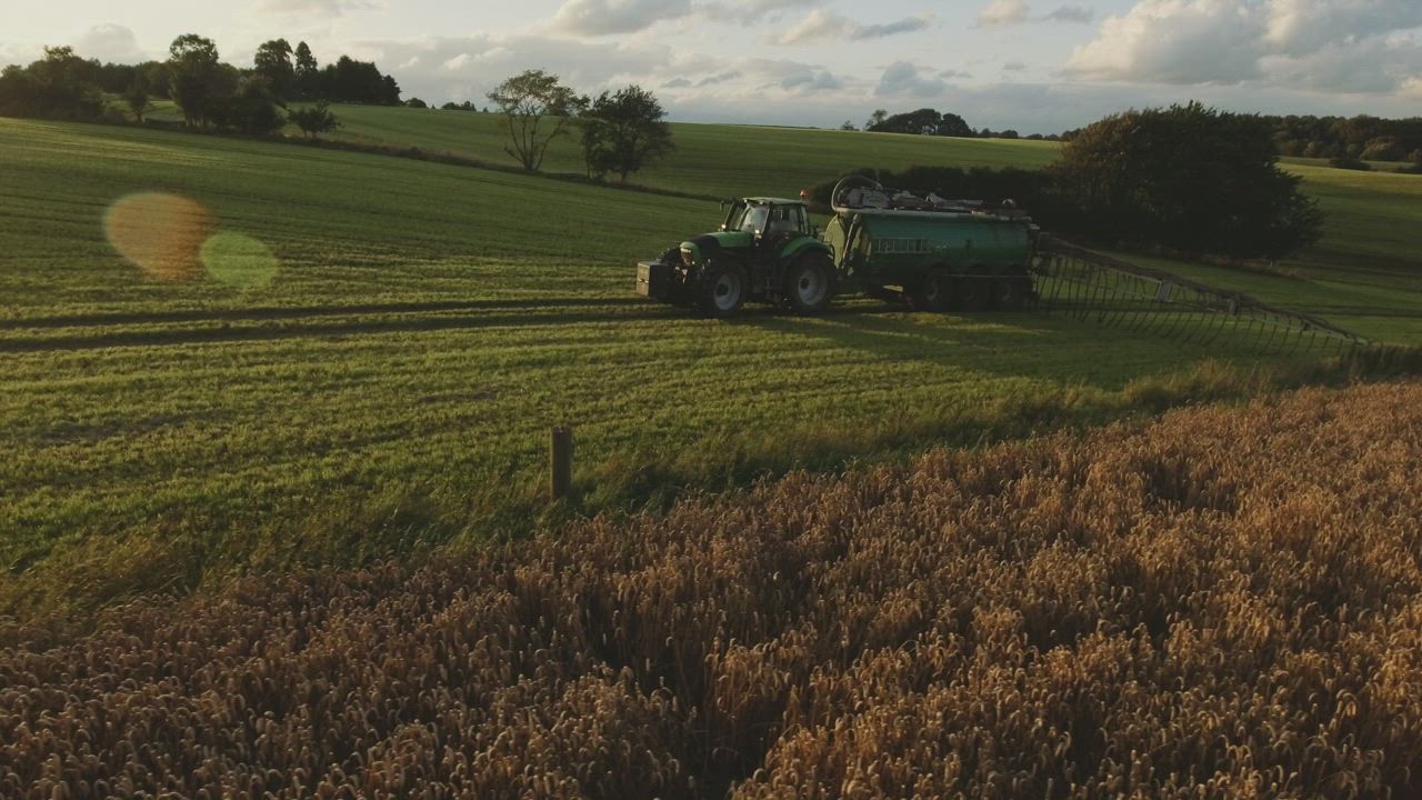 Tractor reversing down a hill - Free Stock Video