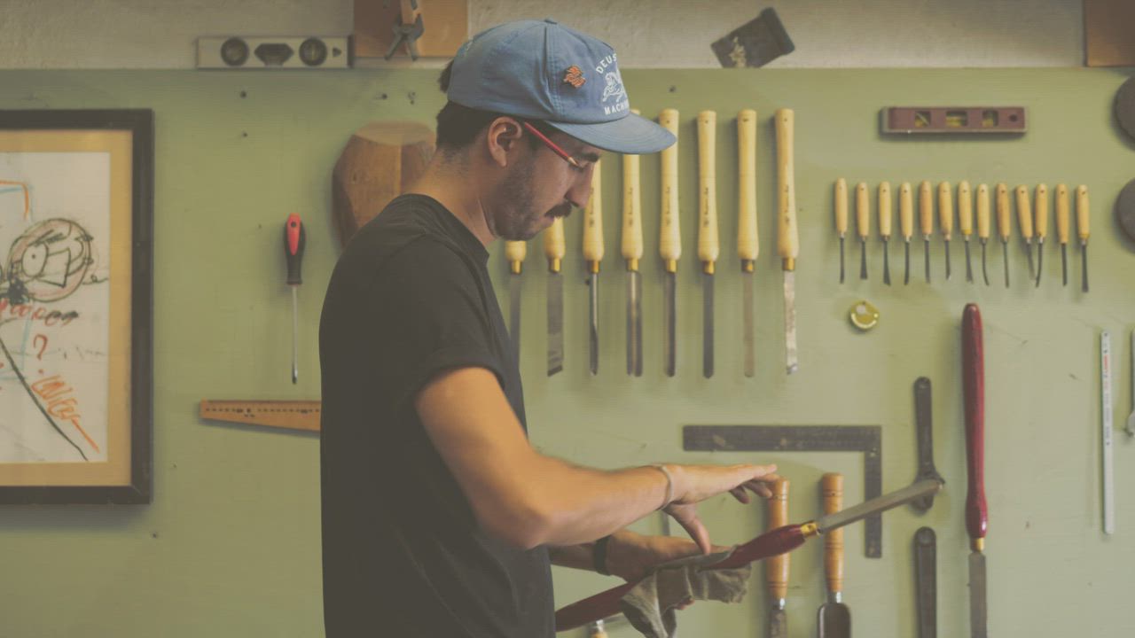 A carpenter cleaning his tools - Free Stock Video