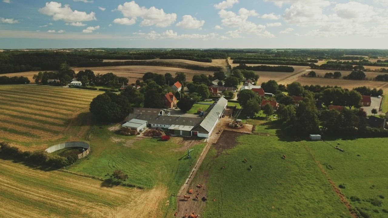 Drone flying over a farm - Free Stock Video