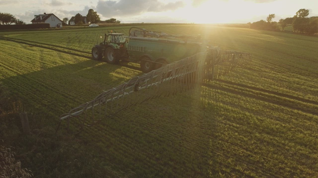 Tractor preparing to spray a field - Free Stock Video
