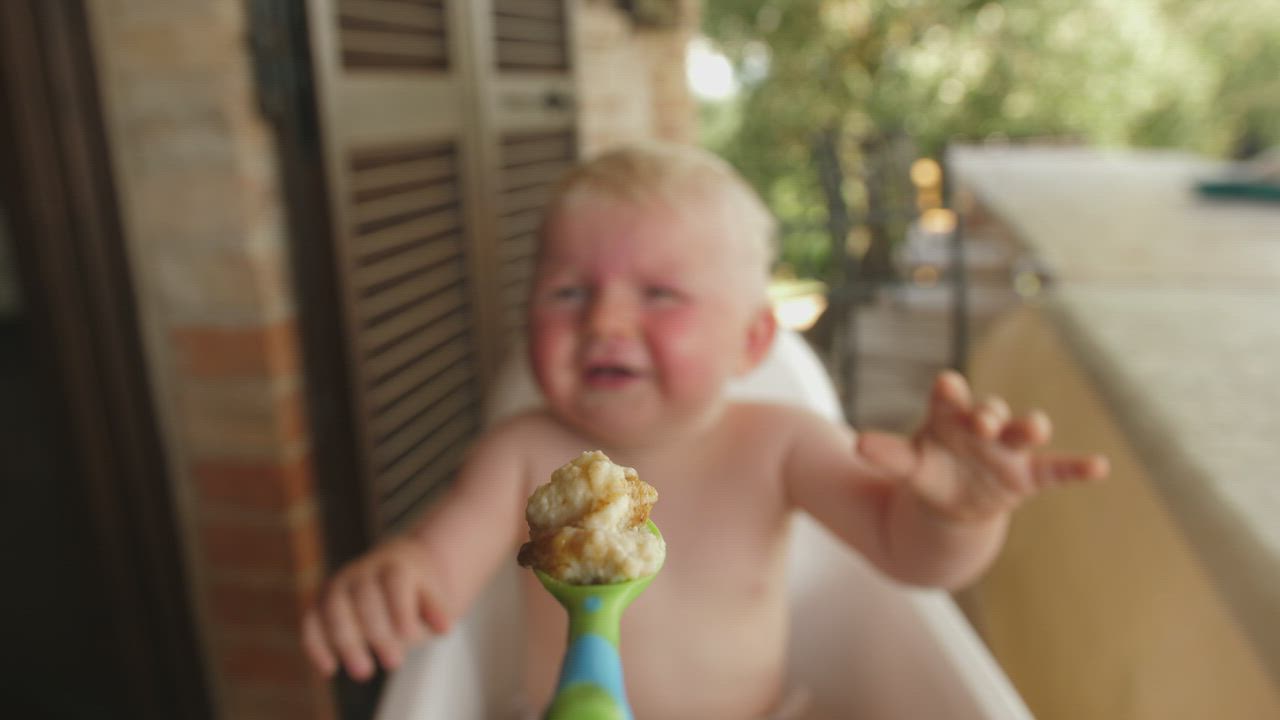 Feeding a baby outside - Free Stock Video