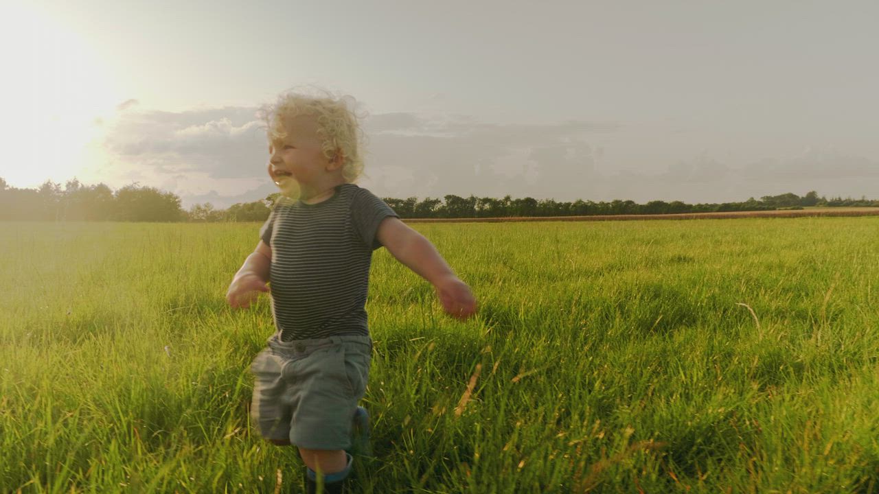 Young boy walking outside - Free Stock Video