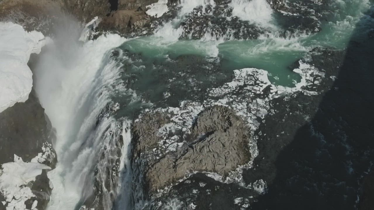 Drone flying over a waterfall - Free Stock Video